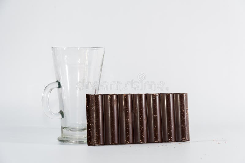 Dark Chocolate Bar Next To an Empty Glass Stock Image - Image of food ...
