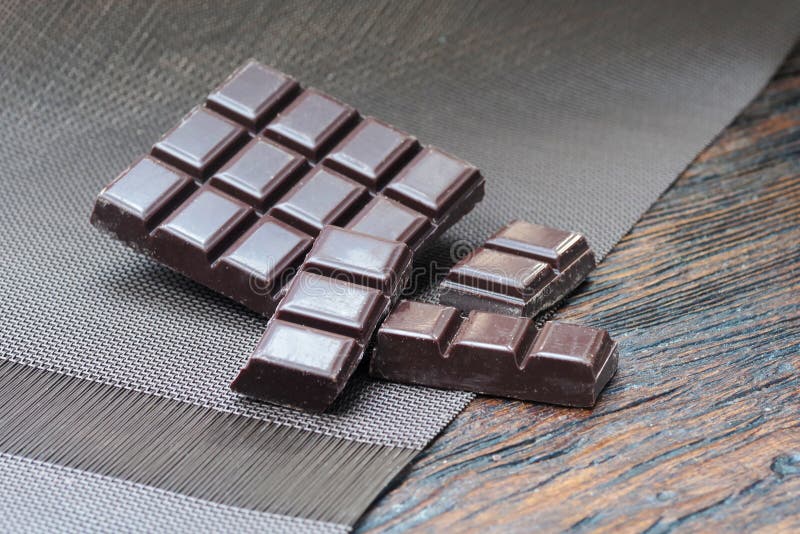 Dark Chocolate. Broken Chocolate Bar on Kitchen Table Stock Photo ...
