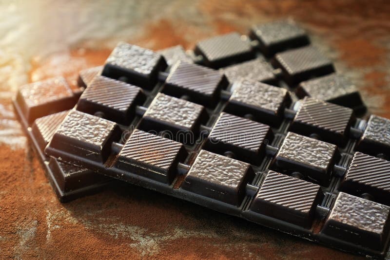 Dark Chocolate and Brown Cocoa Powder on the Table, Closeup. Background ...