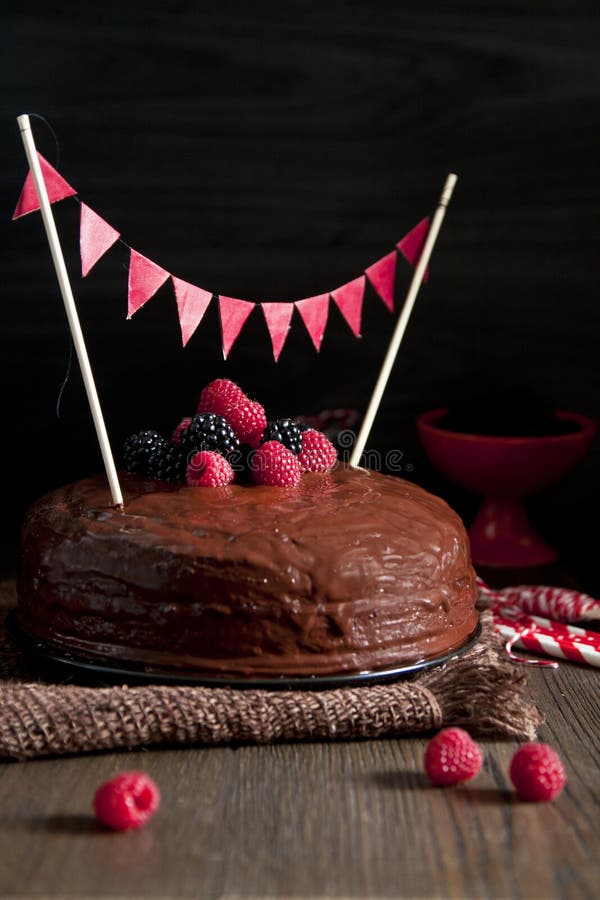 Dark Chocolate Cake with Red Flags Stock Photo - Image of sugar, dish ...