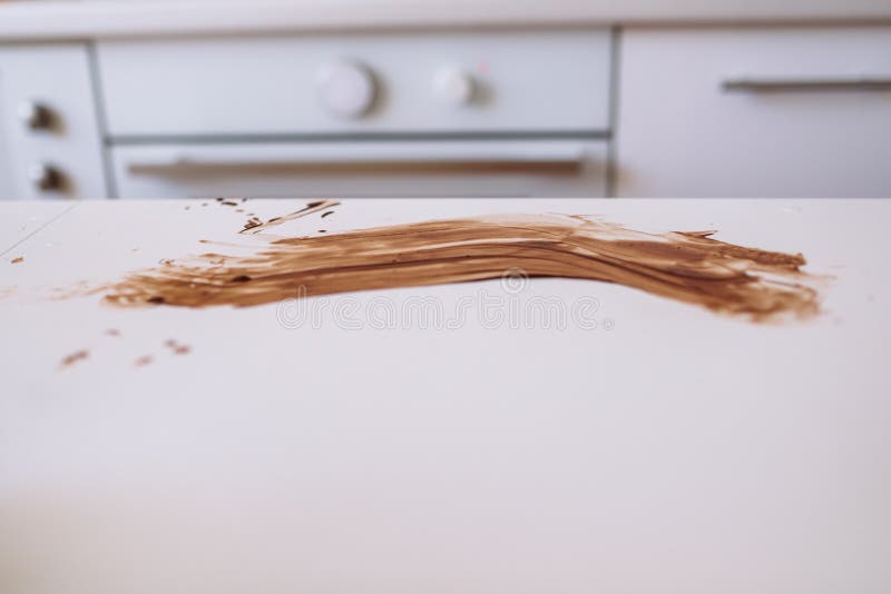 Dark Chocolate Smeared on a White Table in a Bright Kitchen Stock Photo ...