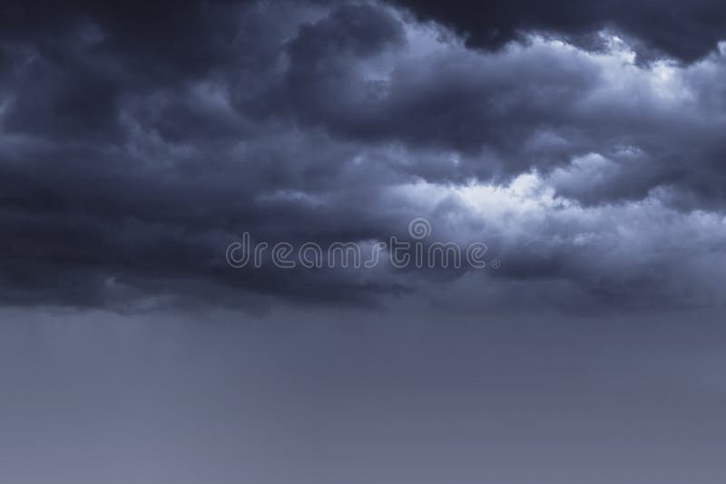 Dark Cloud Background with Rainfall and Light Showing through the ...