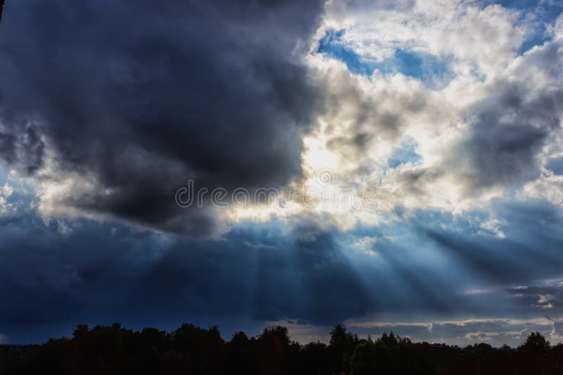 A Dark Cloud Covers the Sun and the Blue Sky Stock Photo - Image of ...