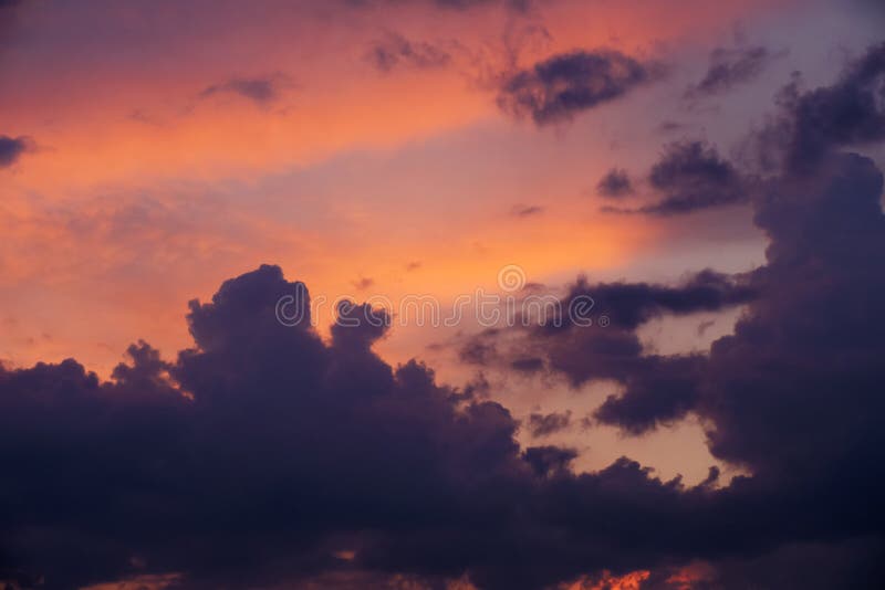 Dark Clouds Against a Scarlet Pink Sky during Sunset Stock Photo ...