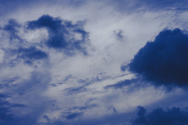 Dark Clouds in Blue Sky Background. Dark Rain Clouds Floating in Sunset ...