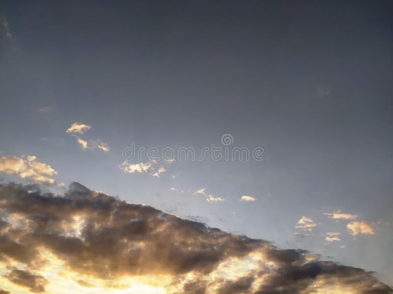 Dark Clouds in Blue Sky Backlit Sun Stock Photo - Image of scenic, dusk ...