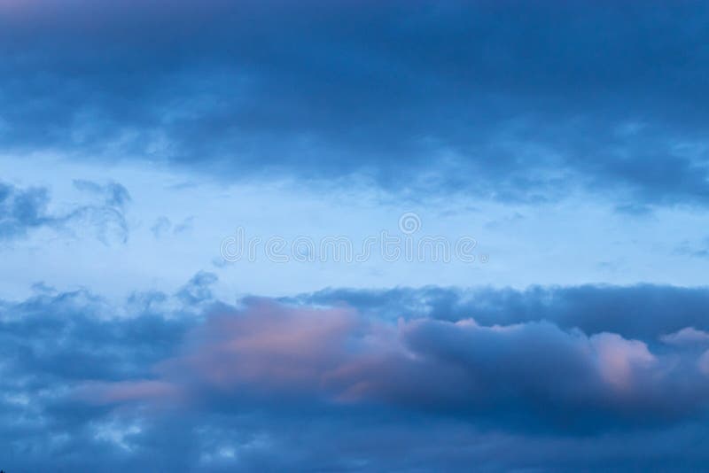 Dark Clouds Color the Sky Gray Blue and Purple during Sunset Stock ...
