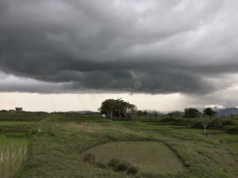 Dark Clouds Covered the Mountain Ranges and Farm Fields Stock Image ...