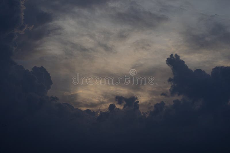 Dark Clouds with Dimmed Lights in the Background Stock Image - Image of ...