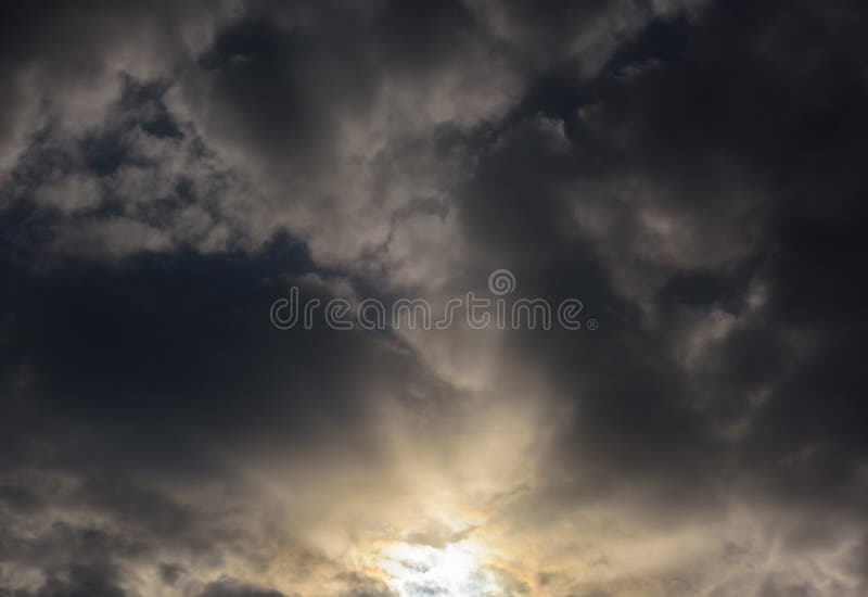 Dark Clouds of Doom with Sun in Background Stock Image - Image of date ...