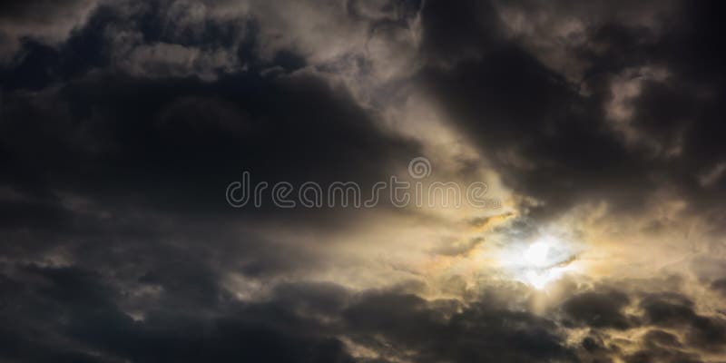 Dark Clouds of Doom with Sun in Background Stock Photo - Image of ...