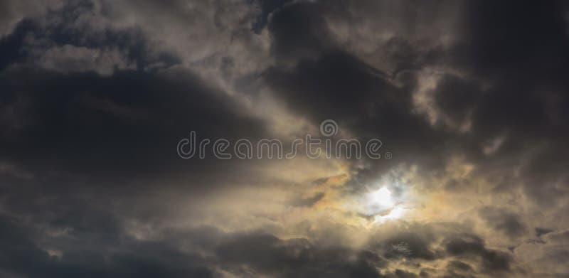 Dark Clouds of Doom with Sun in Background Stock Image - Image of date ...