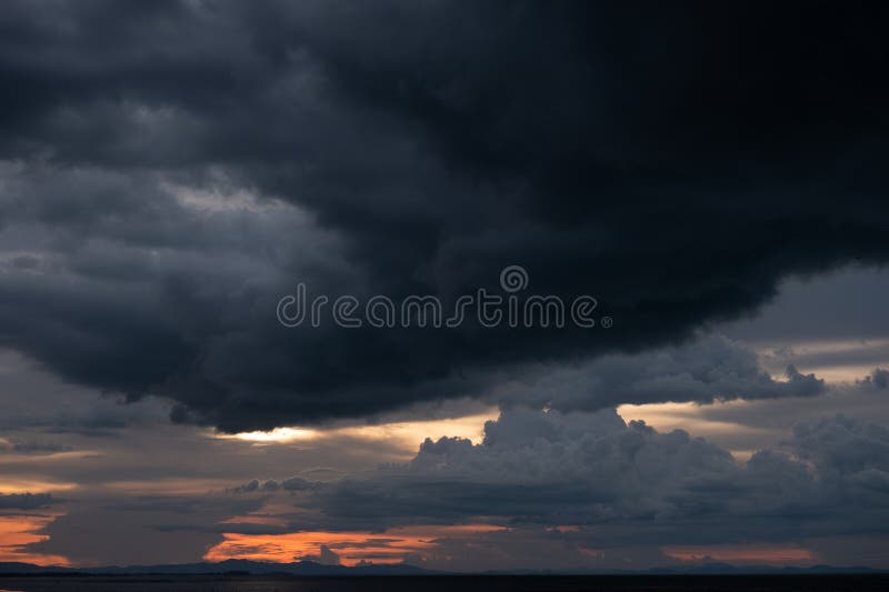 Dark Clouds are Forming, Rain is Falling. during the Sunset Stock Photo ...
