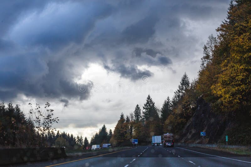 Dramatic Clouds Over Highway in Fall Stock Photo - Image of commute ...