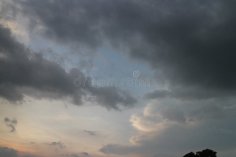 The Dark Sky with Heavy Clouds Converging and a Violent Storm before ...