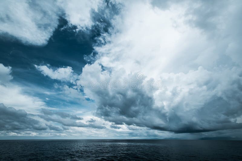Dark clouds in open ocean stock photo. Image of landscape - 93889610