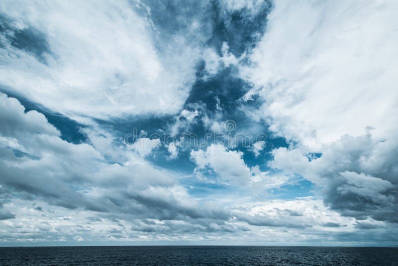 Dark clouds in open ocean stock photo. Image of dark - 112374820