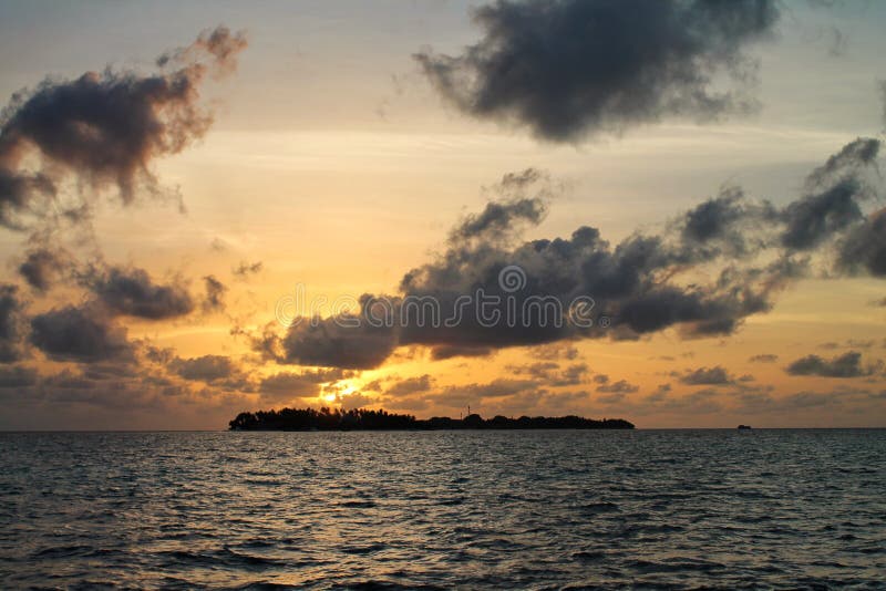Sunset Behind a Tropical Island in the Maldives, Seen from a Boat on ...