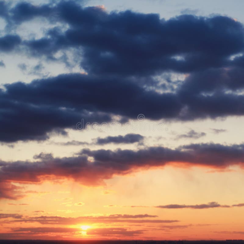 Dark Clouds and Orange Sun in the Evening Haze Stock Image - Image of ...