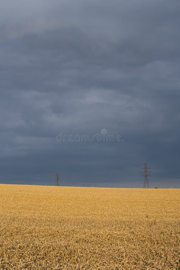 Dark clouds over fields stock image. Image of agriculture - 282835083