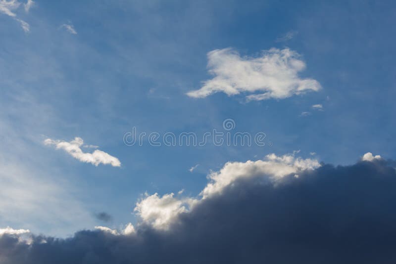 Dark clouds and sun rays stock photo. Image of power - 249973018