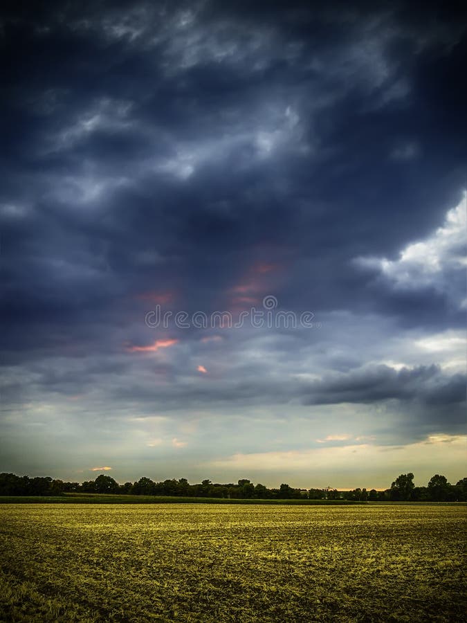 Dark clouds at sunset stock photo. Image of majestic - 33211500