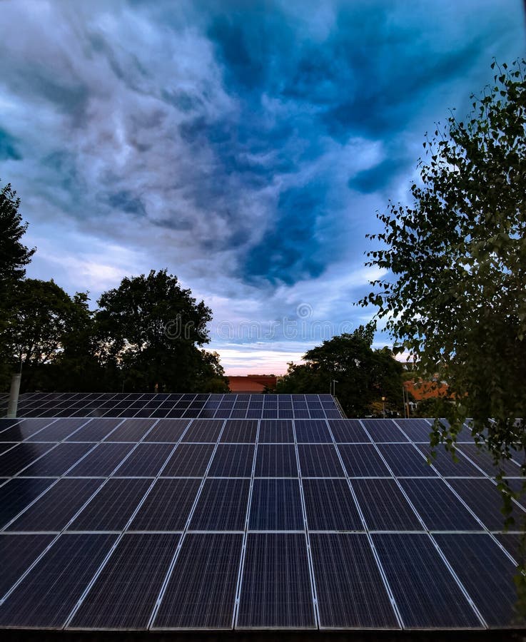 Dark Cloudy Sky Arrangement Over Solar Panels Stock Image - Image of ...