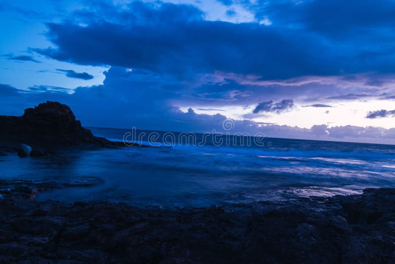 Dark Cloudy Sunset Sky Over the Shore of the Ocean Stock Image - Image ...