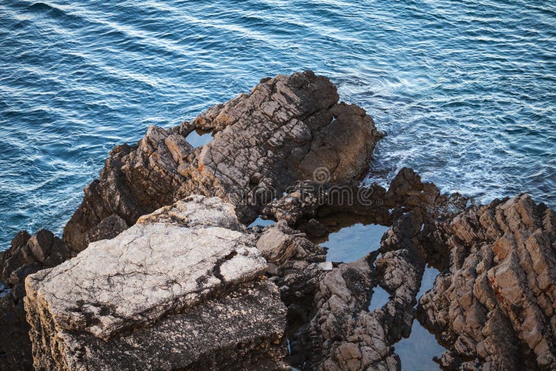 Dark Coastal Rocks on Adriatic Sea Stock Photo - Image of seawater ...