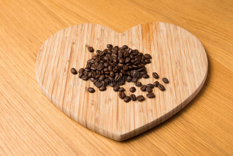 Dark Coffee Beans on Heart Shaped Chopping Board Stock Photo - Image of ...