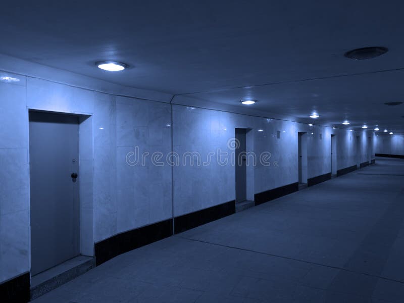 Dark Concrete Corridor with a Closed Doors Stock Photo - Image of built ...