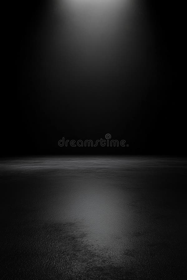 A Dramatic Spotlight Illuminates a Dark and Reflective Concrete Floor ...