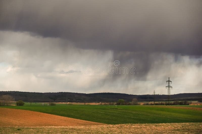 Dark Dense Rain Cloud with Rain Over Different Fields and a Forest ...