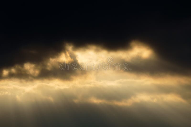 Dark Dramatic Sky at Sunset with Sun Rays through the Clouds Stock ...