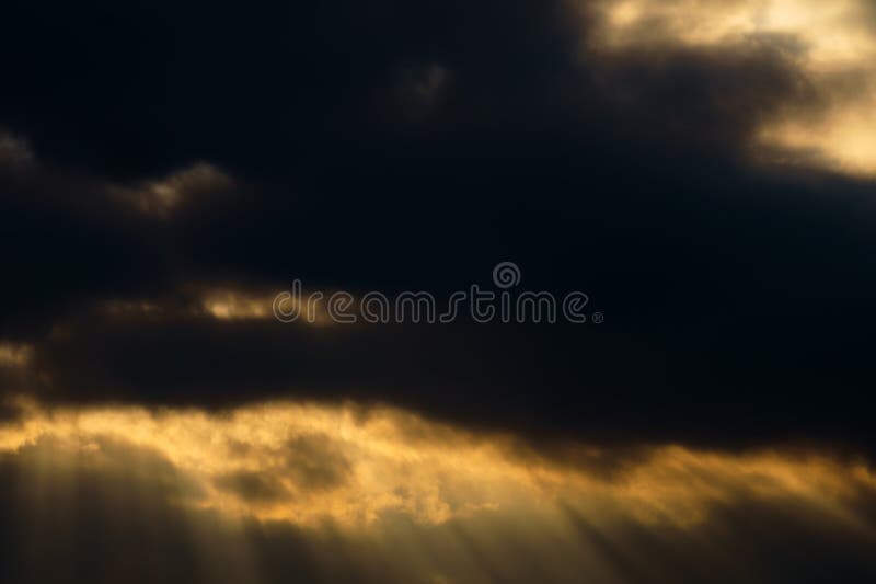 Dark Dramatic Sky at Sunset with Sun Rays through the Clouds Stock ...