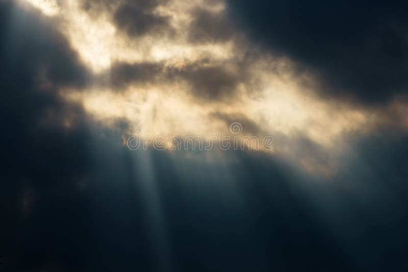 Dark Dramatic Sky at Sunset with Sun Rays through the Clouds Stock ...