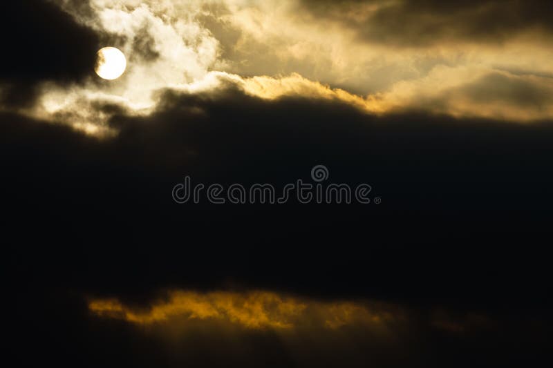 Dark Dramatic Sky at Sunset with Sun Rays through the Clouds Stock ...