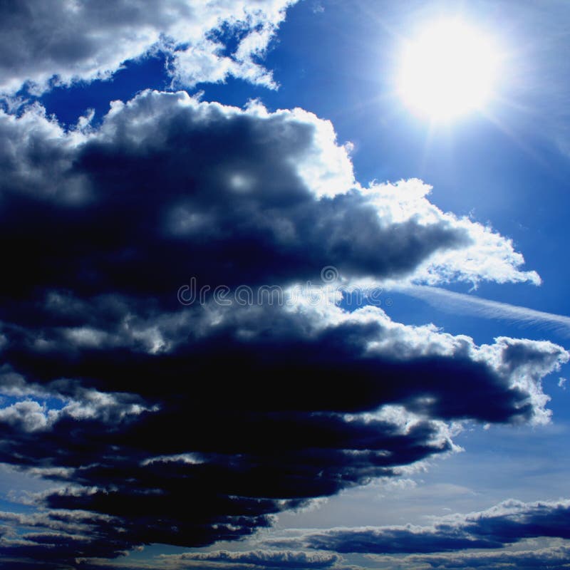 Dark Fluffy Clouds on Background of Blue Sky Stock Photo - Image of ...