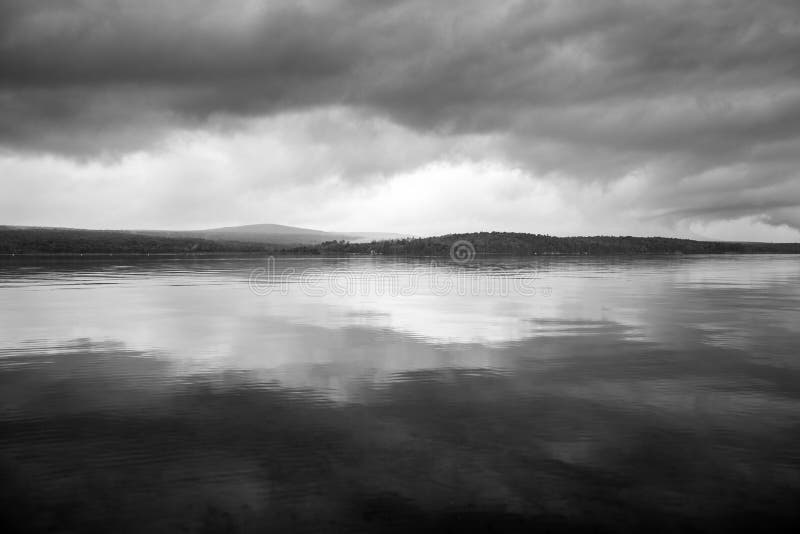 Dark, Foreboding Storm Clouds Over a Gloomy Lake Landscape Stock Image ...