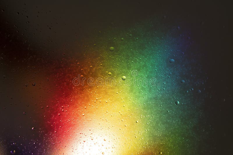 Dark Glowing Background with Water Drops with an Explosion of Rainbow ...