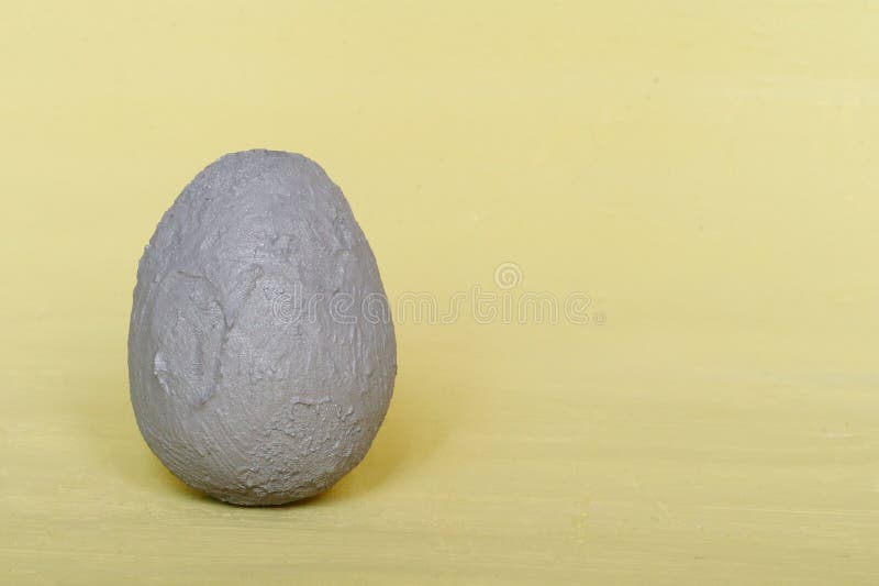 Decorative Egg Painted with Coarse Gray Paint on a Pastel Background ...