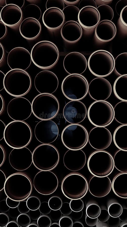 Dark Gray Plastic Tubes in a Stack Vertical Stock Photo Stock Image ...