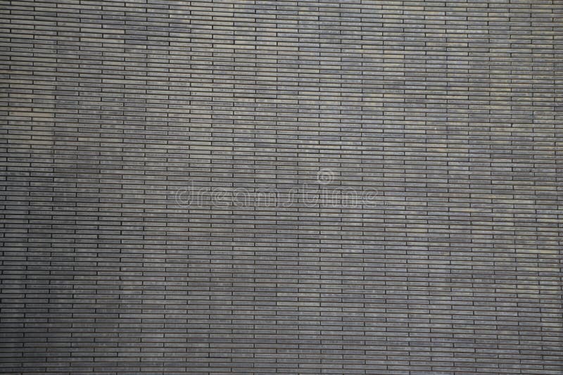 Dark Gray Wall with Horizontal Lines of Small Rectangular Tiles ...