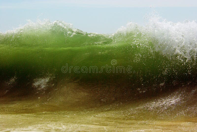 A Big Green Beachbreak Wave Against Blue Sky Stock Image - Image of ...