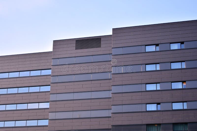 A View at a Straight Facade of a Modern Building with a Dark Grey ...