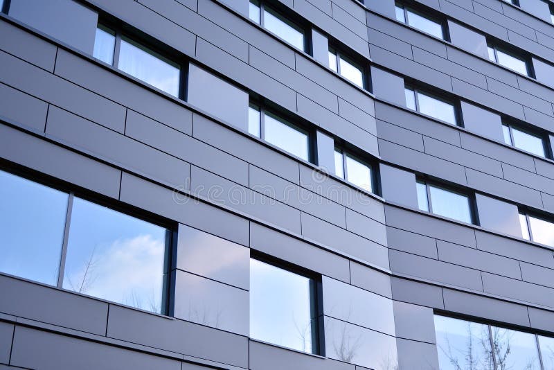 A View at a Straight Facade of a Modern Building with a Dark Grey ...