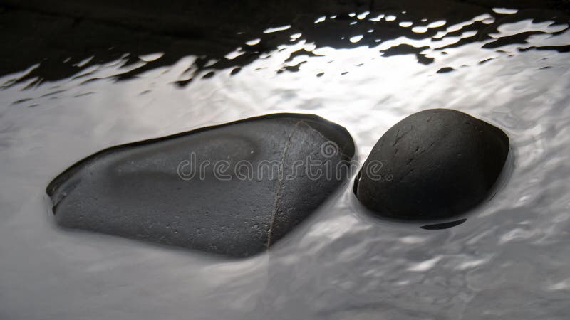 Dark Grey Rocks in a Pool on a Beach. Abstract Nature Background Stock ...