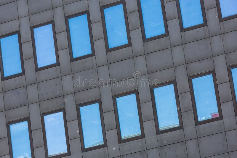 A Dark Grey Tall Building with Reflective Glass Windows Stock Photo ...
