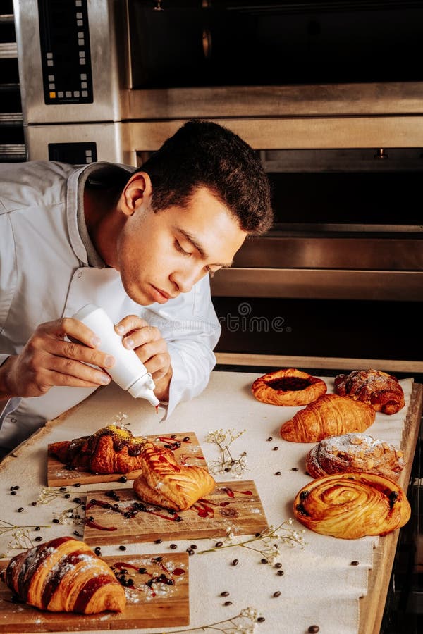 Dark-haired Baker Decorating Pastry Desserts for His Master Class Stock ...