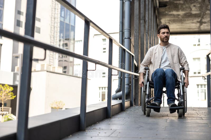 Dark-haired Bearded Young Man on a Wheelchair Stock Photo - Image of ...